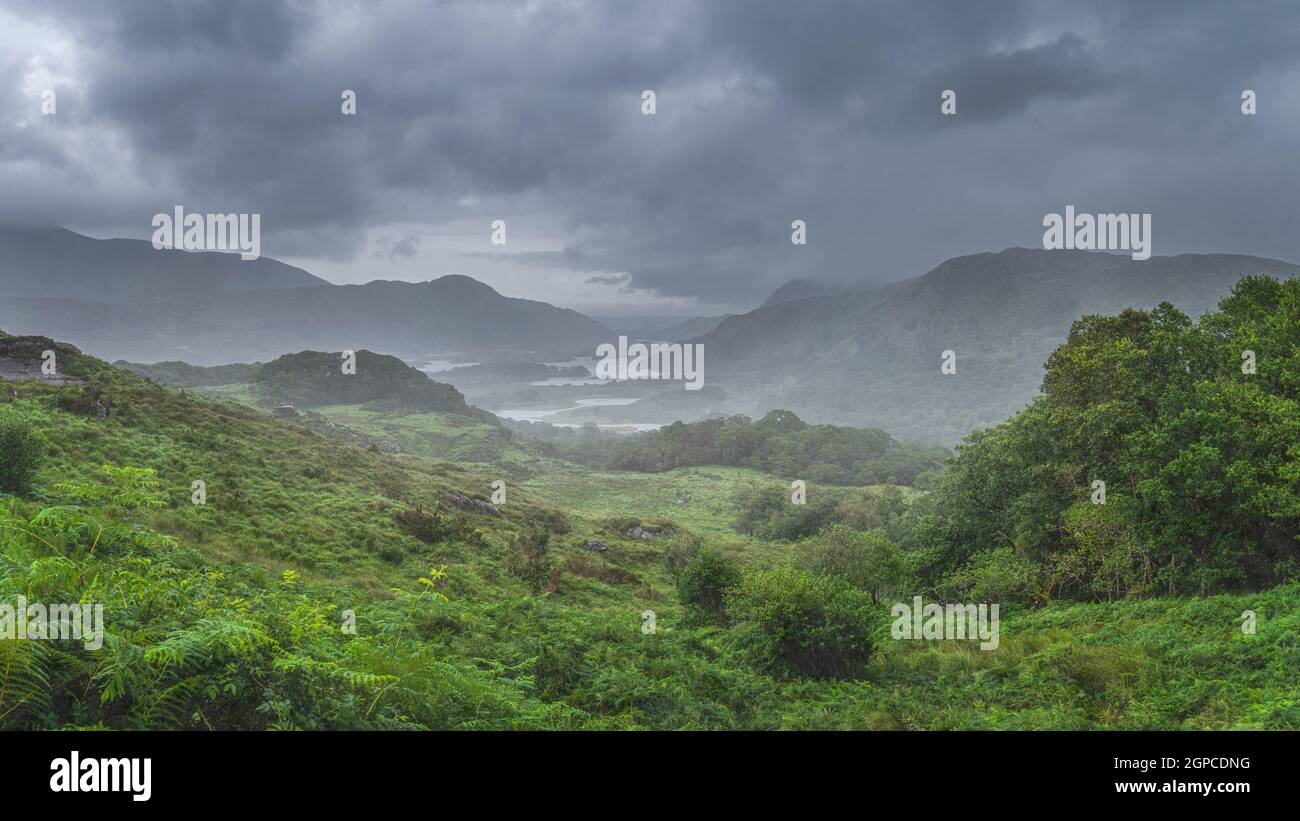 Atmospheric, dramatic storm sky and clouds, mist and heavy rain in ...