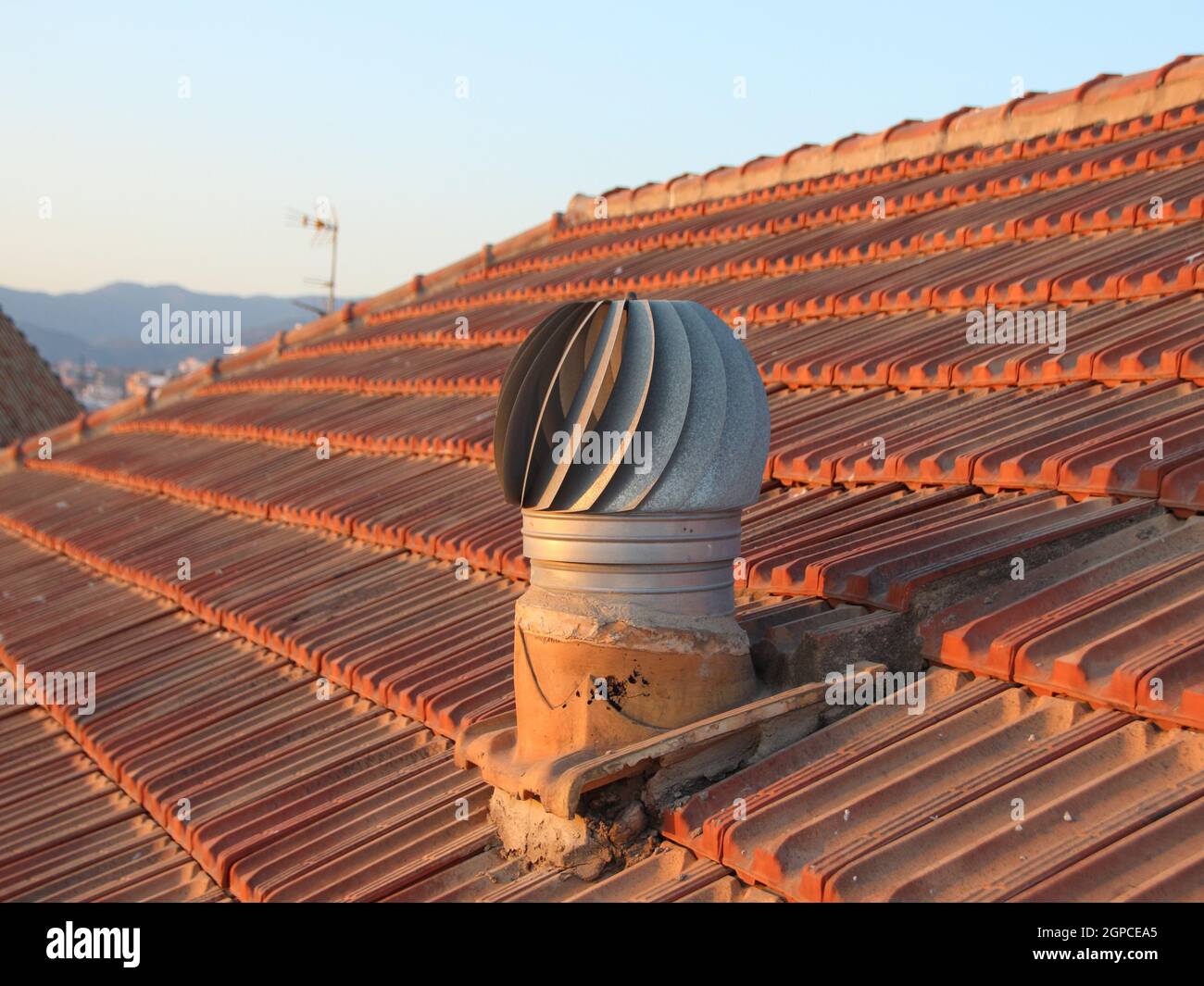 Ventilation Metal Chimney on Shingle Roof with View Stock Photo - Alamy