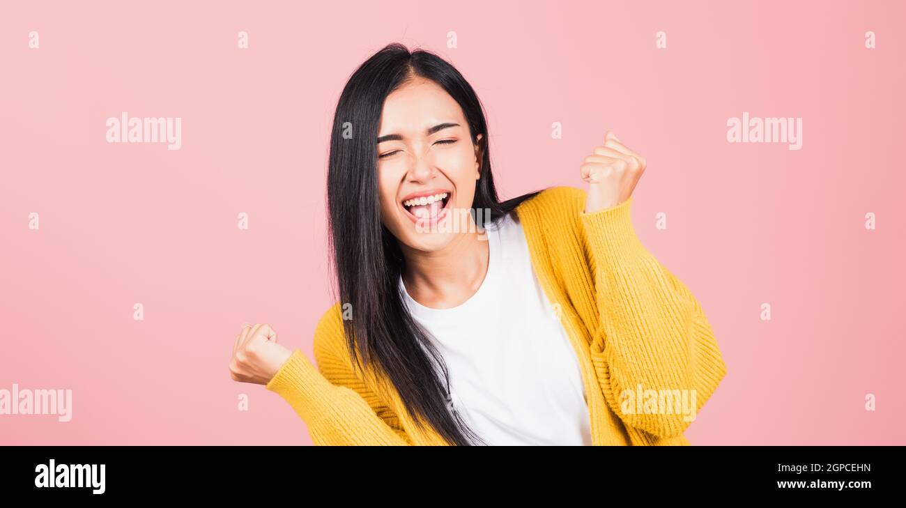 Happy Asian portrait beautiful cute young woman standing winning and ...