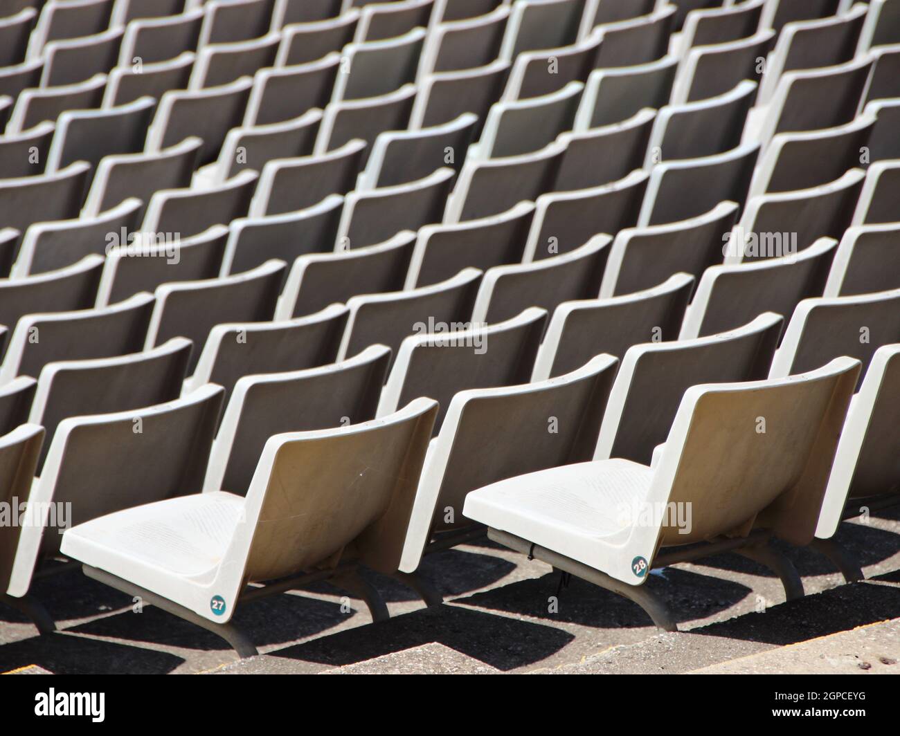 Perspective of Spectator Seats at Sports Arena with Blue Running Lanes ...
