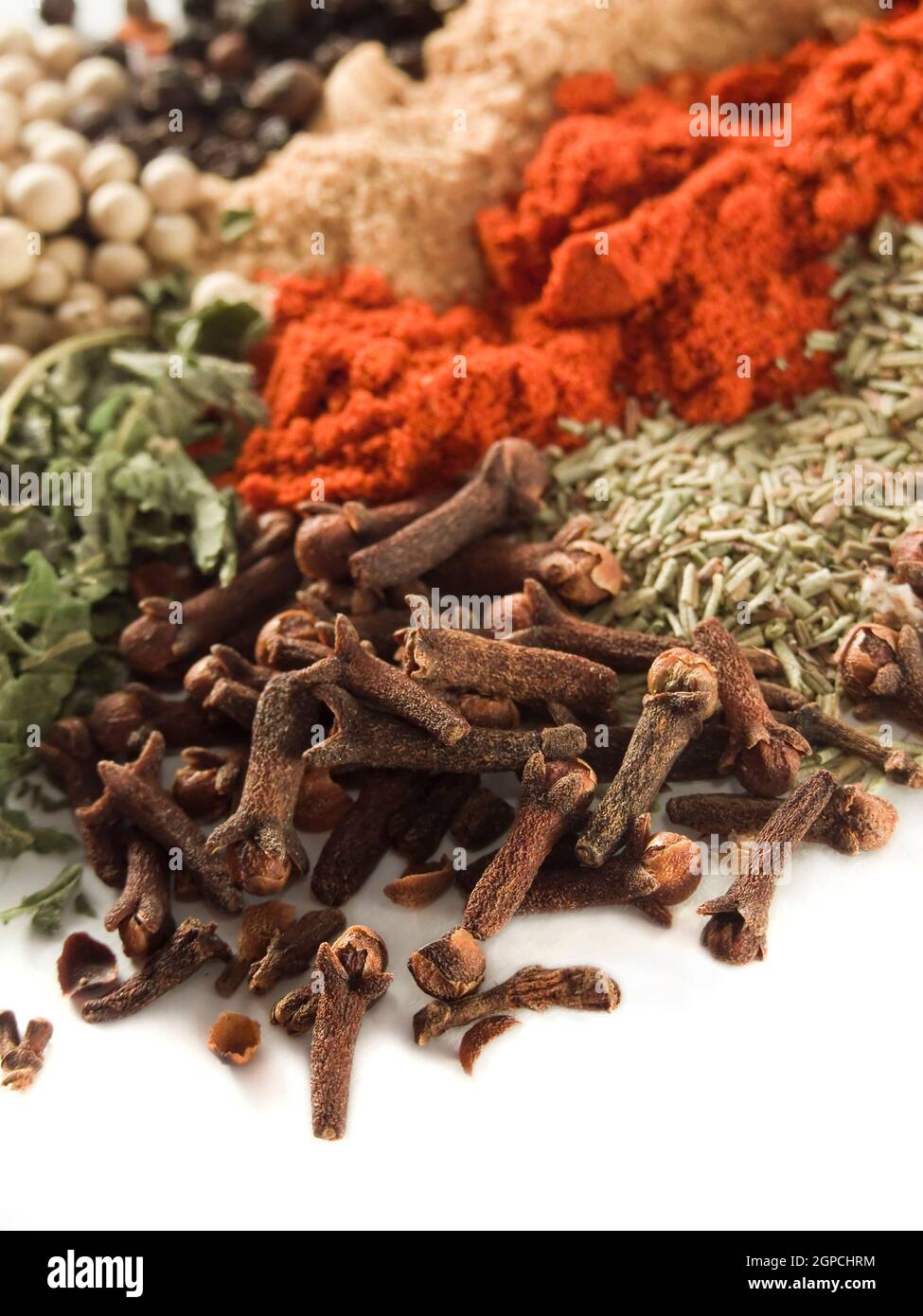 closeup of various spices over white Stock Photo - Alamy