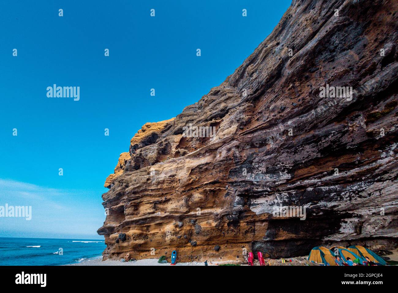 Natural background. Closeup edged shabby cliff cracks. Gray-brown stone ...