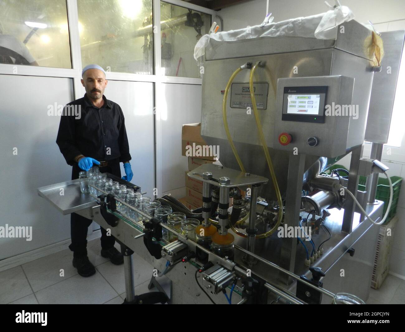 Beirut, Lebanon. 28th Sep, 2021. A worker supervises the process of ...