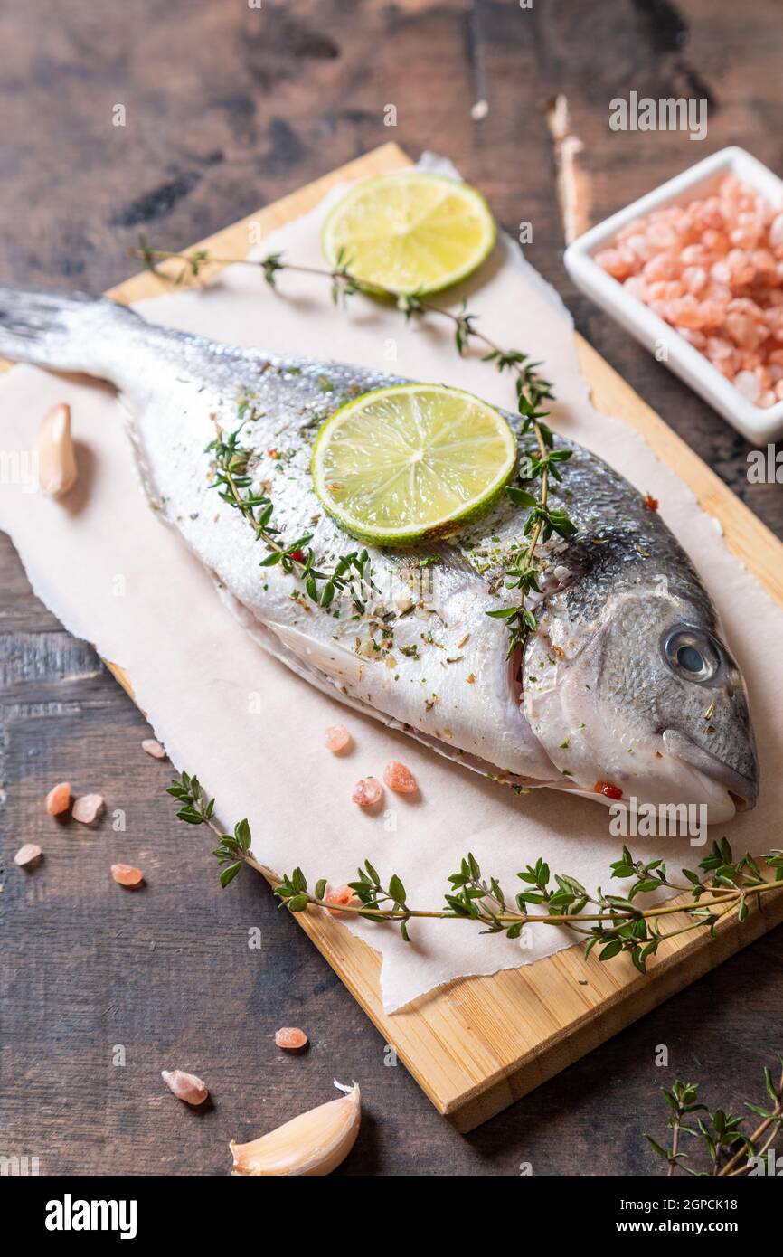 fresh raw dorado fish. dorado fish and cooking ingredients - lime, salt ...