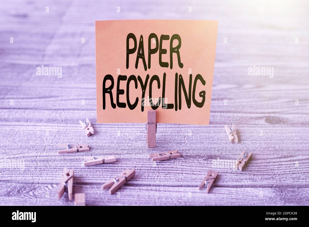 Hand writing sign Paper Recycling. Word Written on Using the waste ...