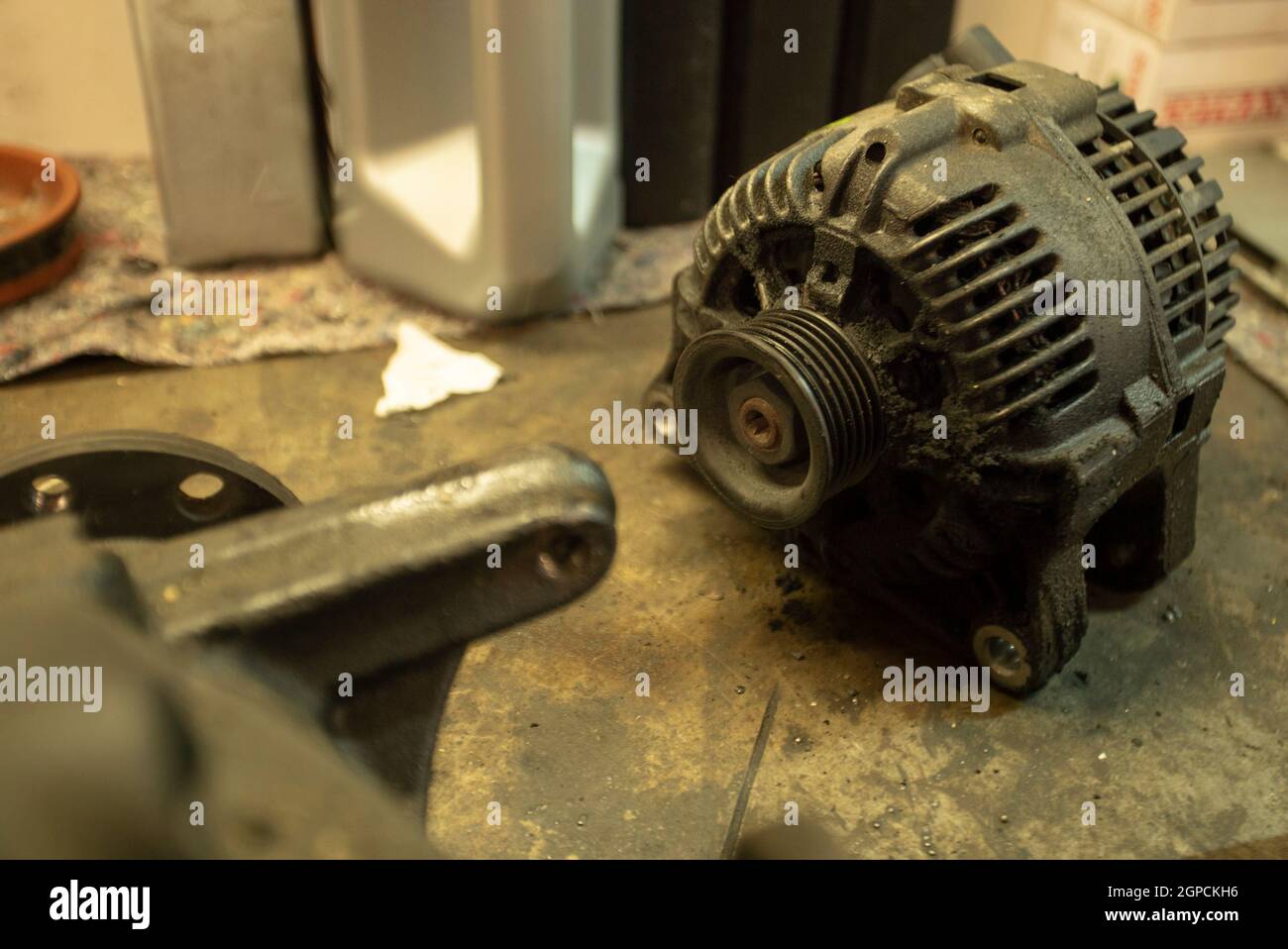 Old worn alternator of the car to be replaced Stock Photo - Alamy