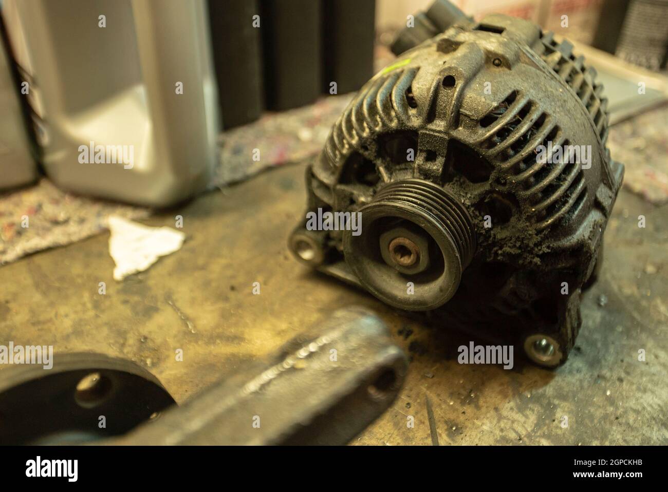 Old worn alternator of the car to be replaced Stock Photo - Alamy