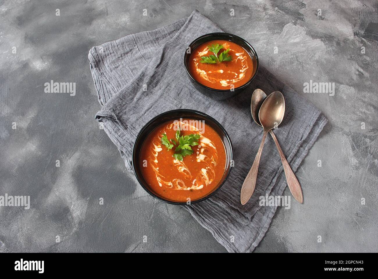 Hot winter soup. Red hot tomato soup with garlic, sweet paprika ...
