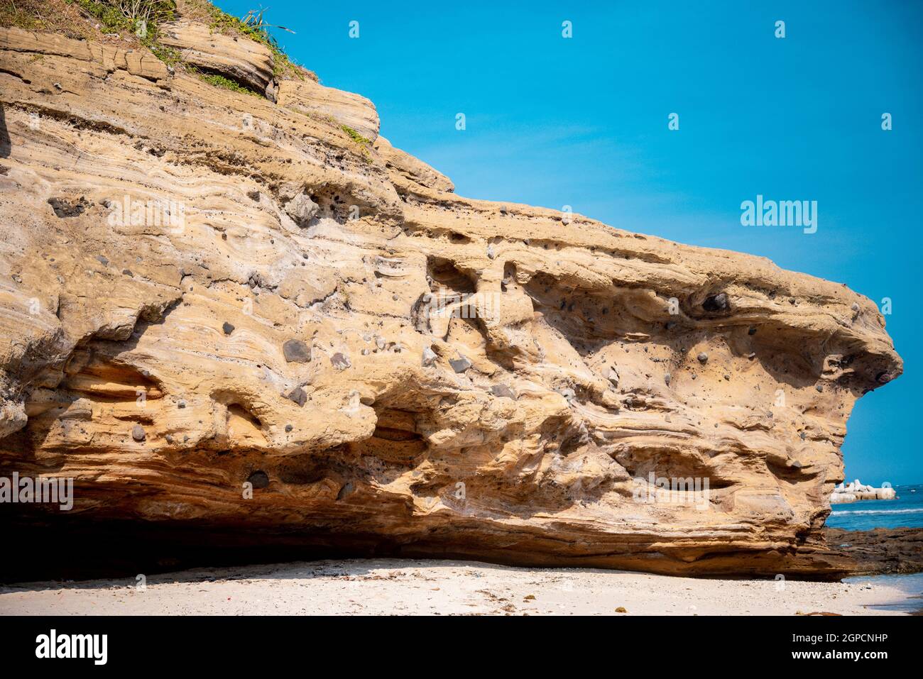 Natural background. Closeup edged shabby cliff cracks. Gray-brown stone ...