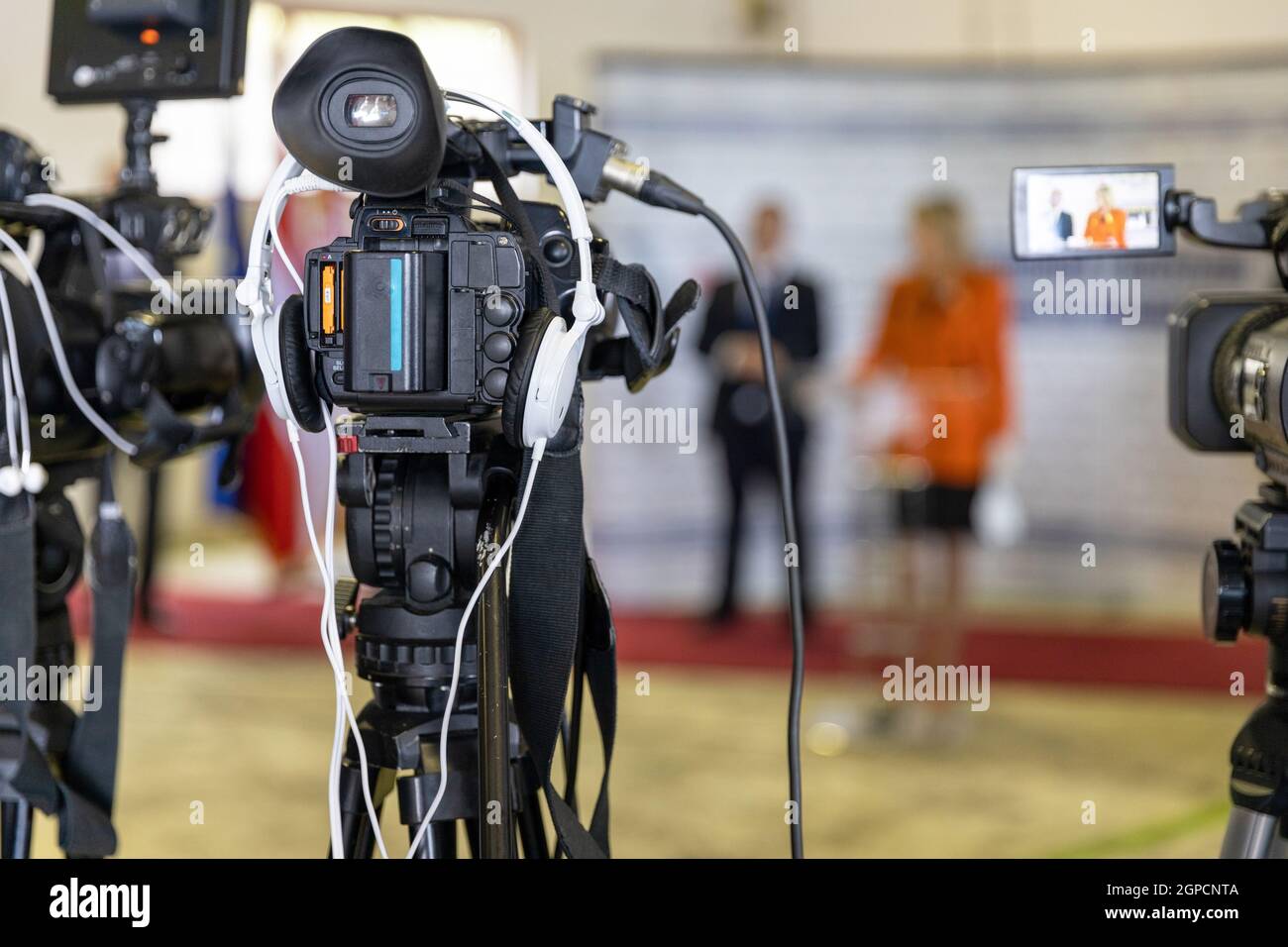 Press briefing or news conference shooting with video camera Stock ...
