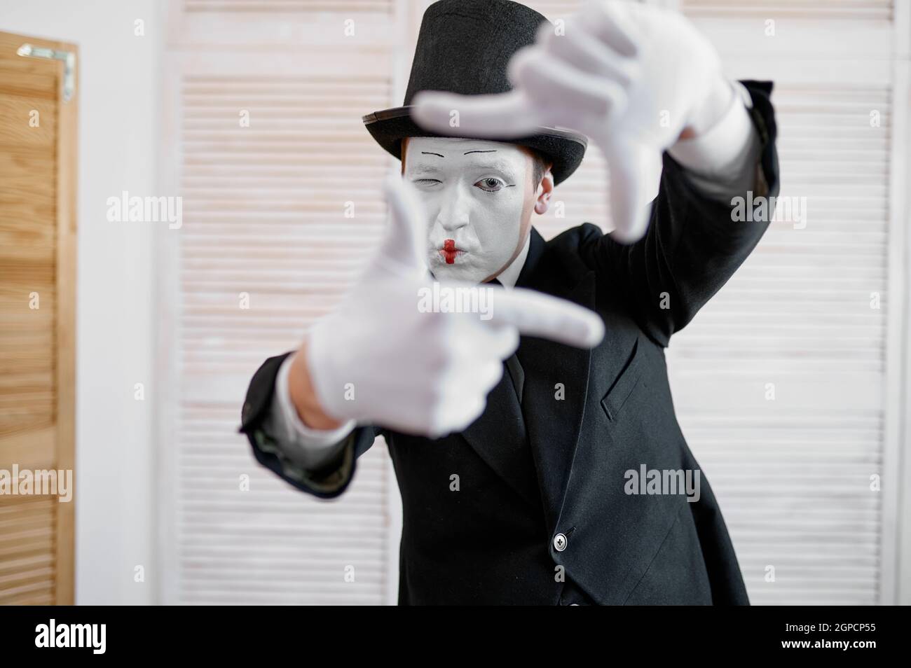 Male mime artist, photo camera gesture, photographer parody. Pantomime ...