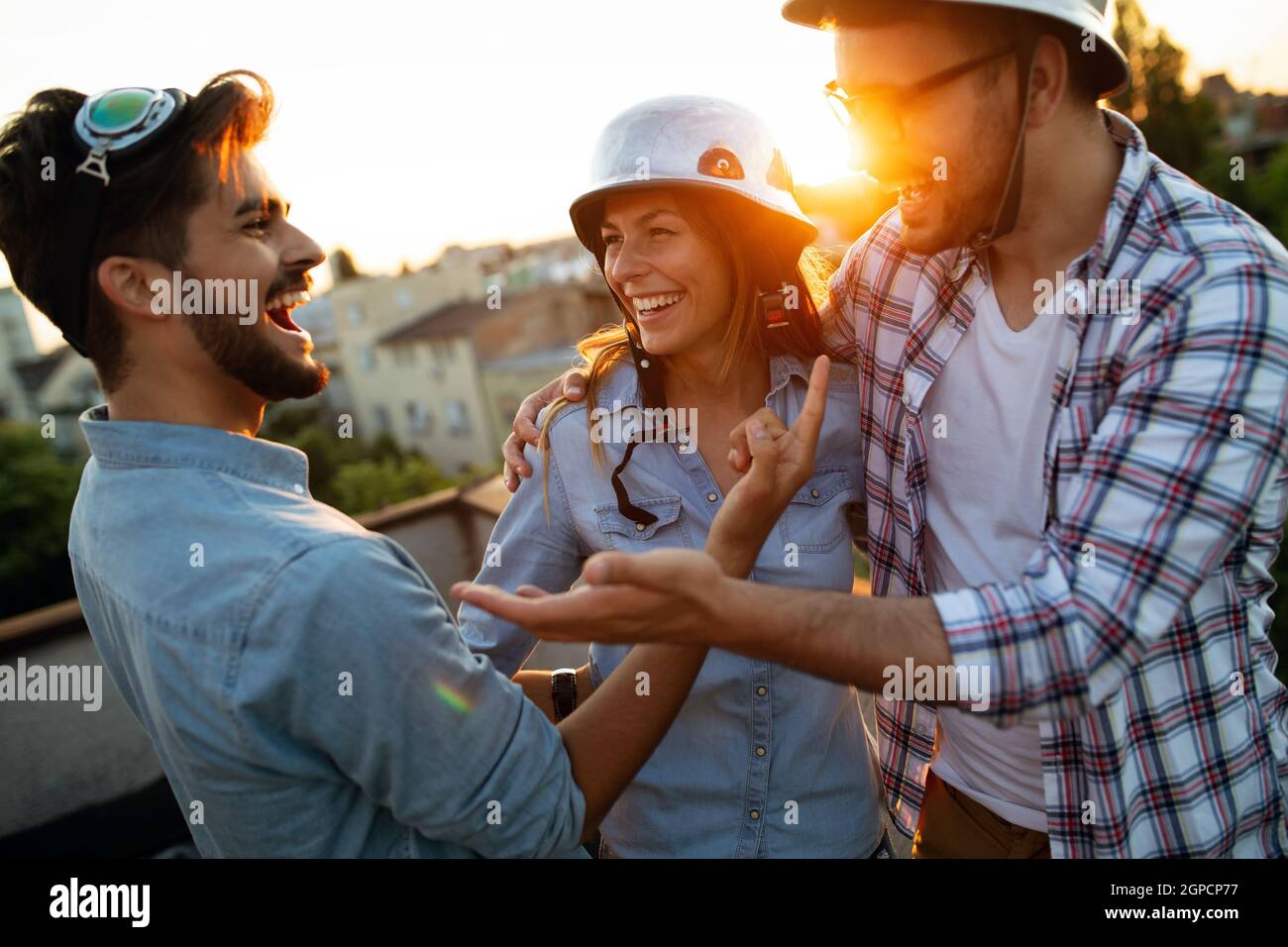 Happy cheerful young friends spending fun times together outdoor Stock ...