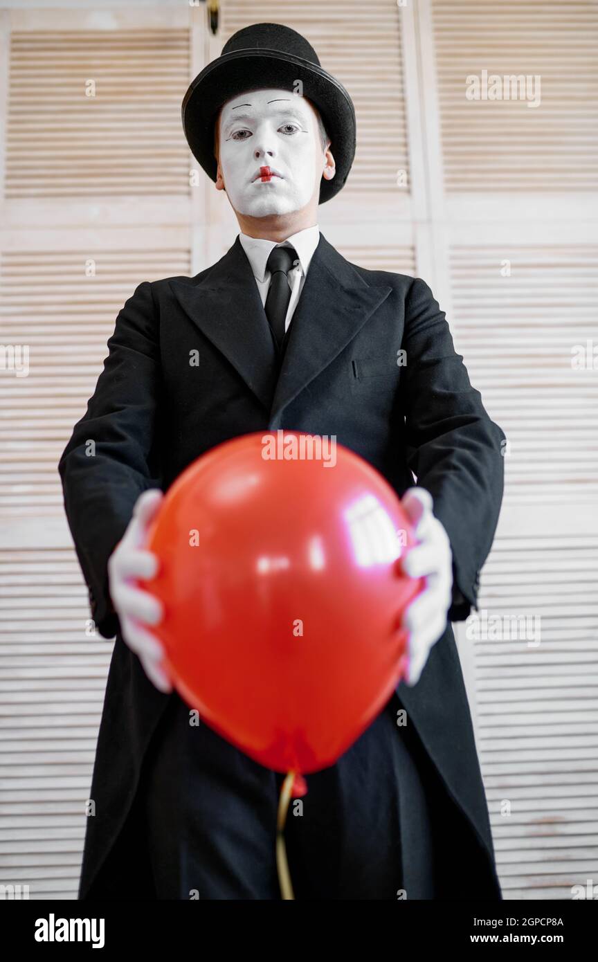 Mime artist, scene with air balloon, comedy parody. Pantomime theater ...