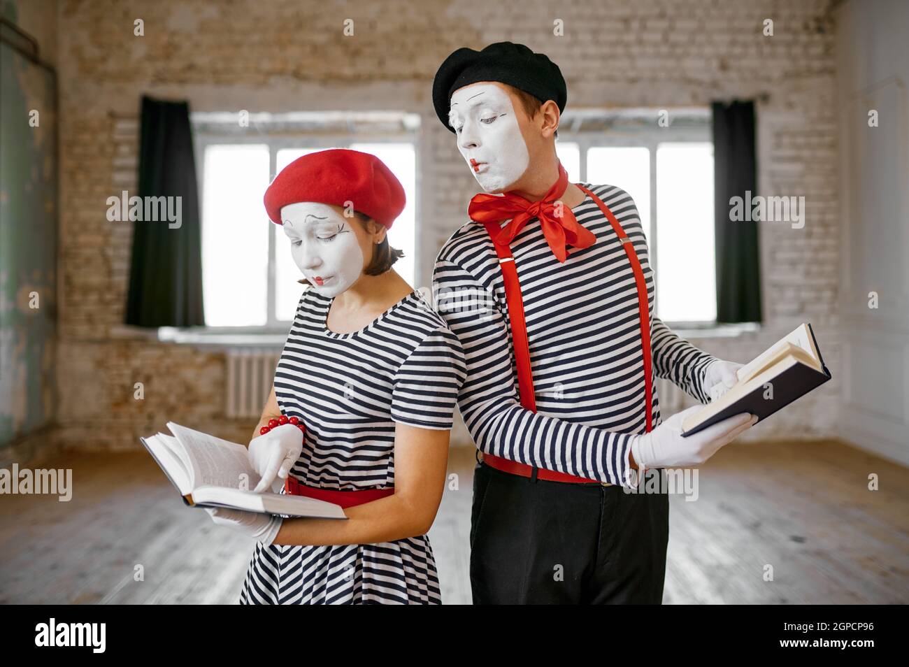 Mime artists, scene with books, student parody comedy. Pantomime ...