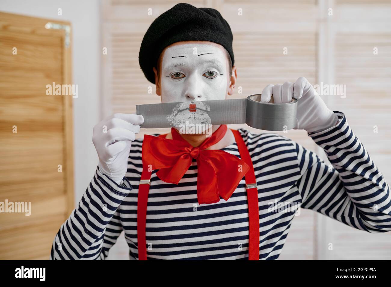 Mime artist with duct tape, parody comedy. Pantomime theater, comedian ...