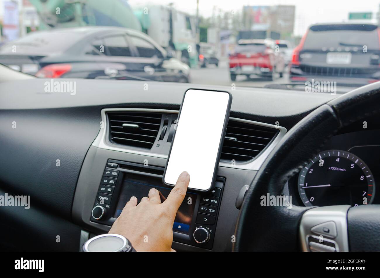 Mobile phone on the car air vent.Blank with white screen.Mock up smart ...