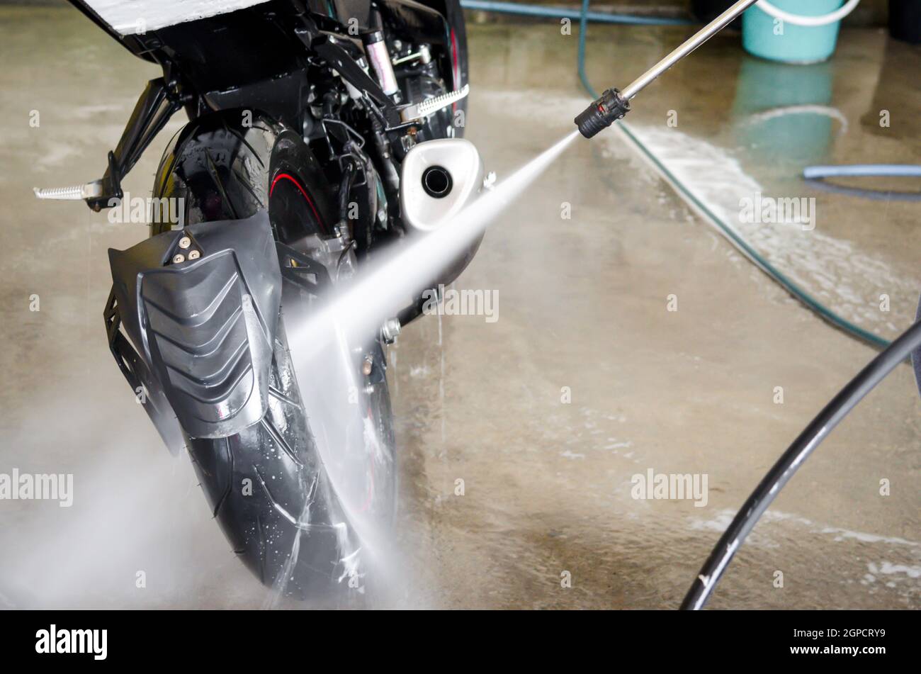 Clean up the motorcycle wash at the car wash shop Stock Photo - Alamy