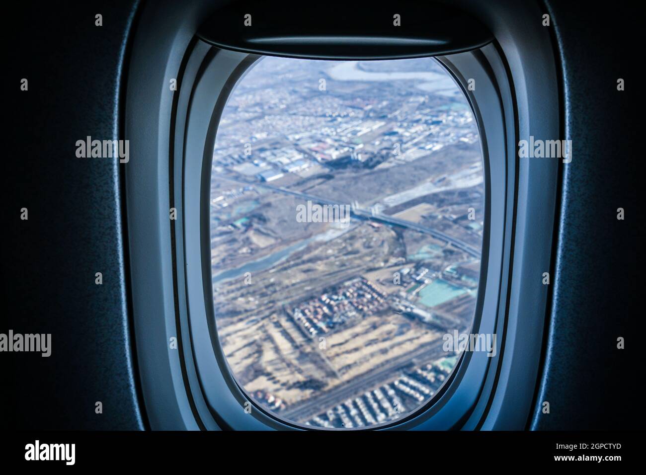 Beijing skyline visible from the window of an airplane. Shooting ...