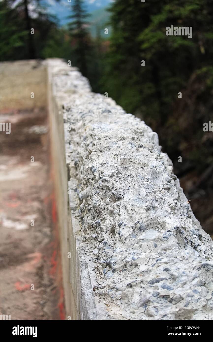 View of the crumbled top of a concret wall Stock Photo - Alamy