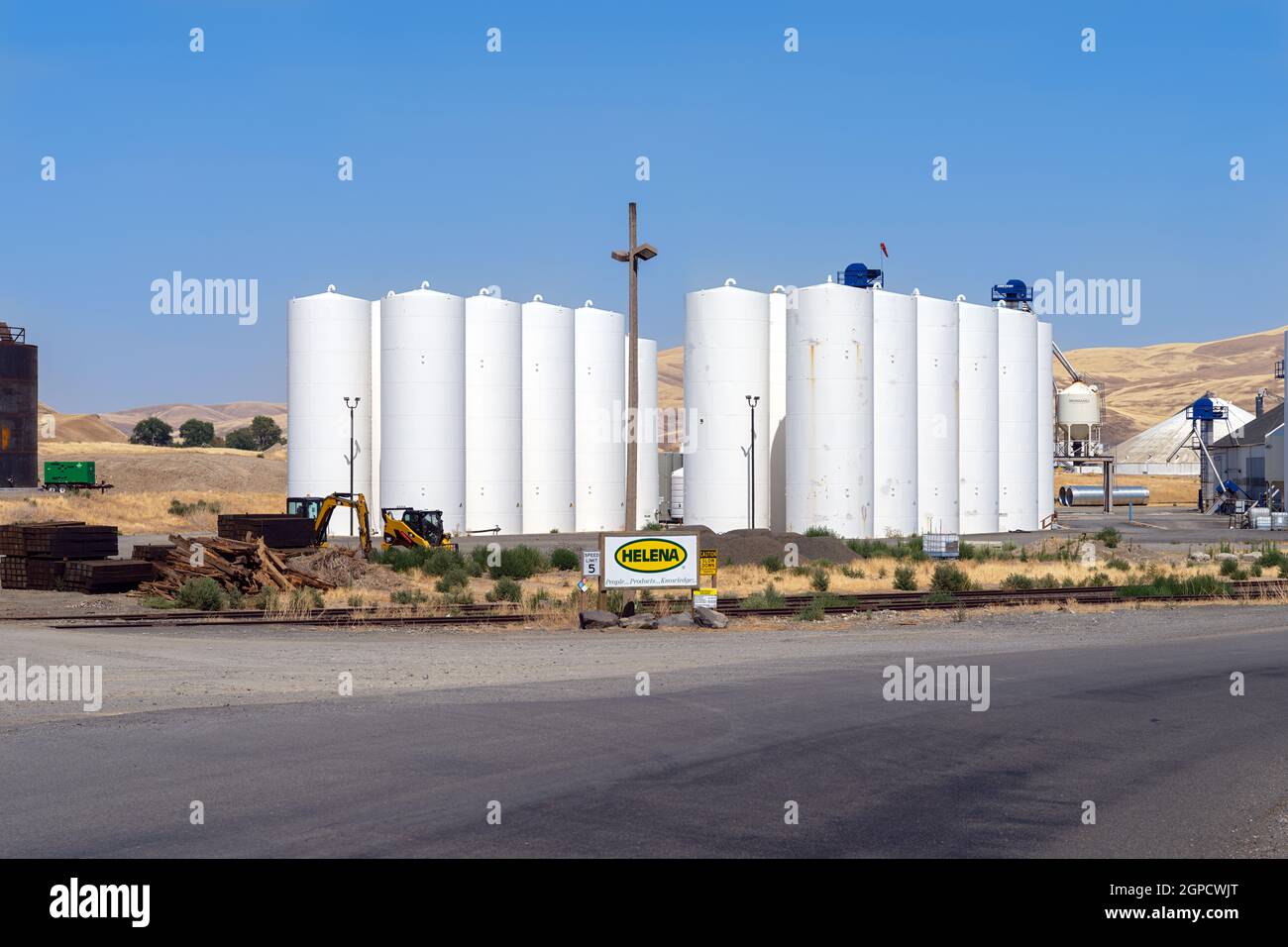 White storage tanks of the Helena Chemical Company at the Port of ...