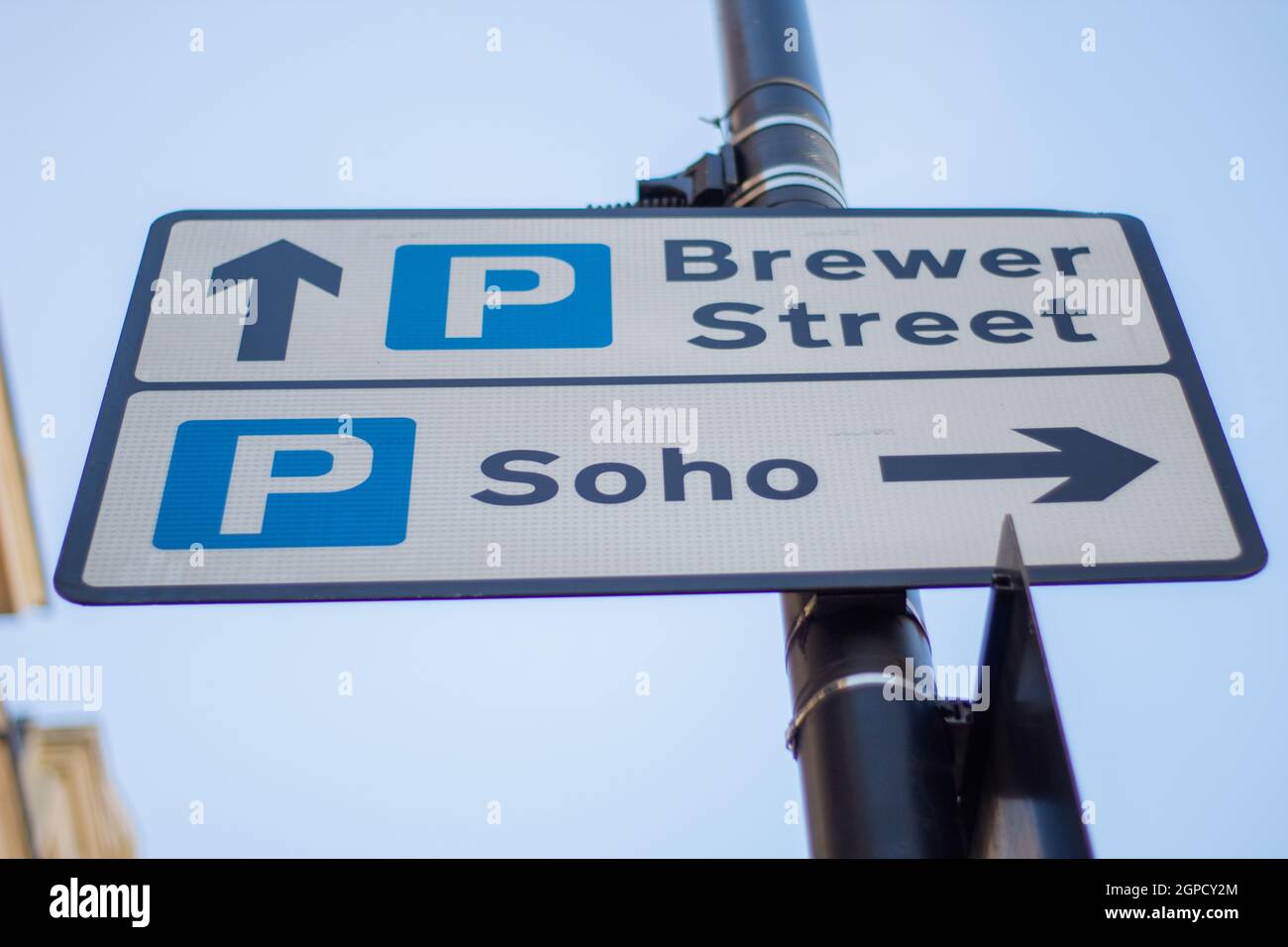 Street sign indicating the way to Soho and Brewer Street. Sign with ...