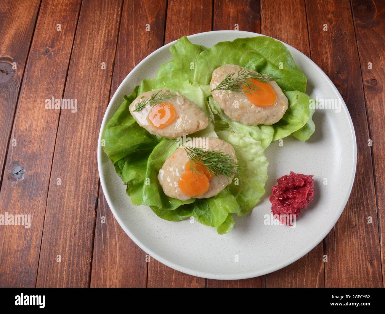 Traditional Jewish Passover food- gefilte fish with carrots, lettuce ...