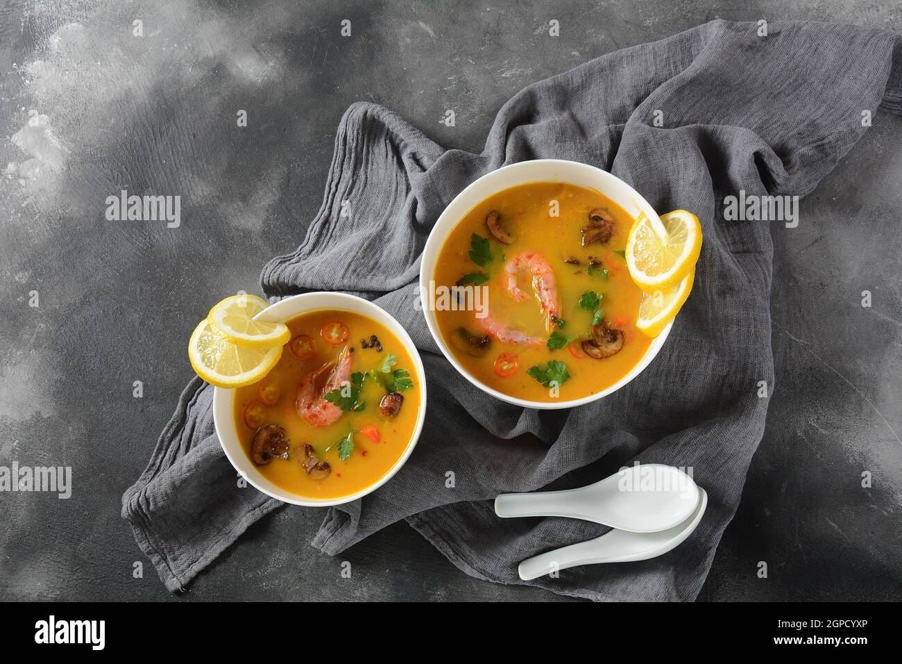 Tom Yum -traditional spicy Thai soup with coconut milk, chilli pepper ...