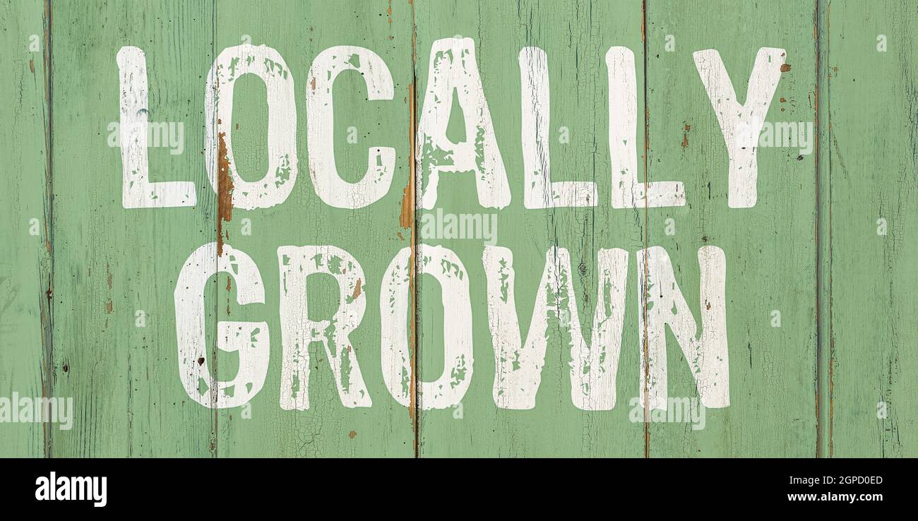 Wooden retro sign - Locally grown Stock Photo - Alamy