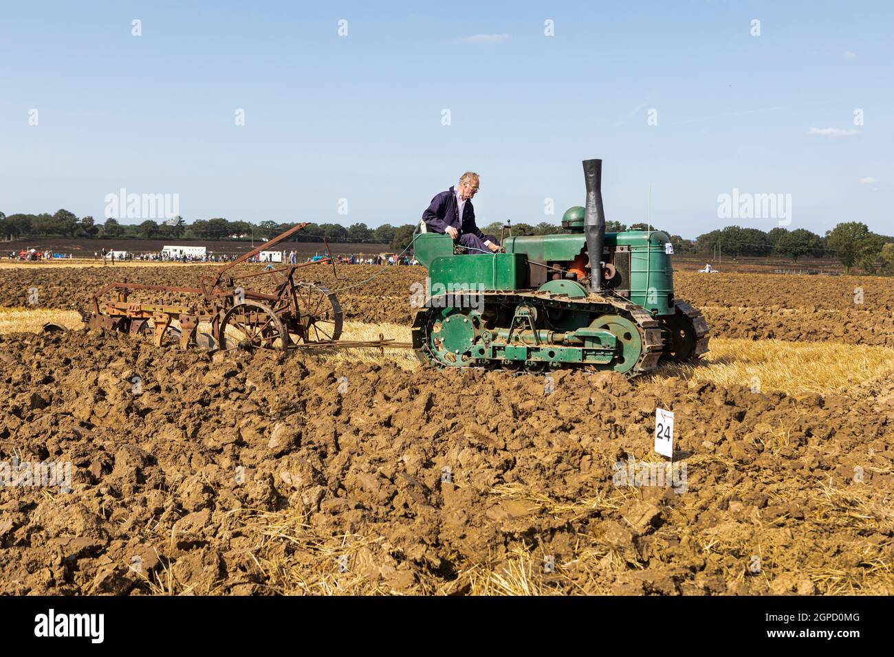 A classic old green Fowler Mark VF crawler tractor ploughing at a ...