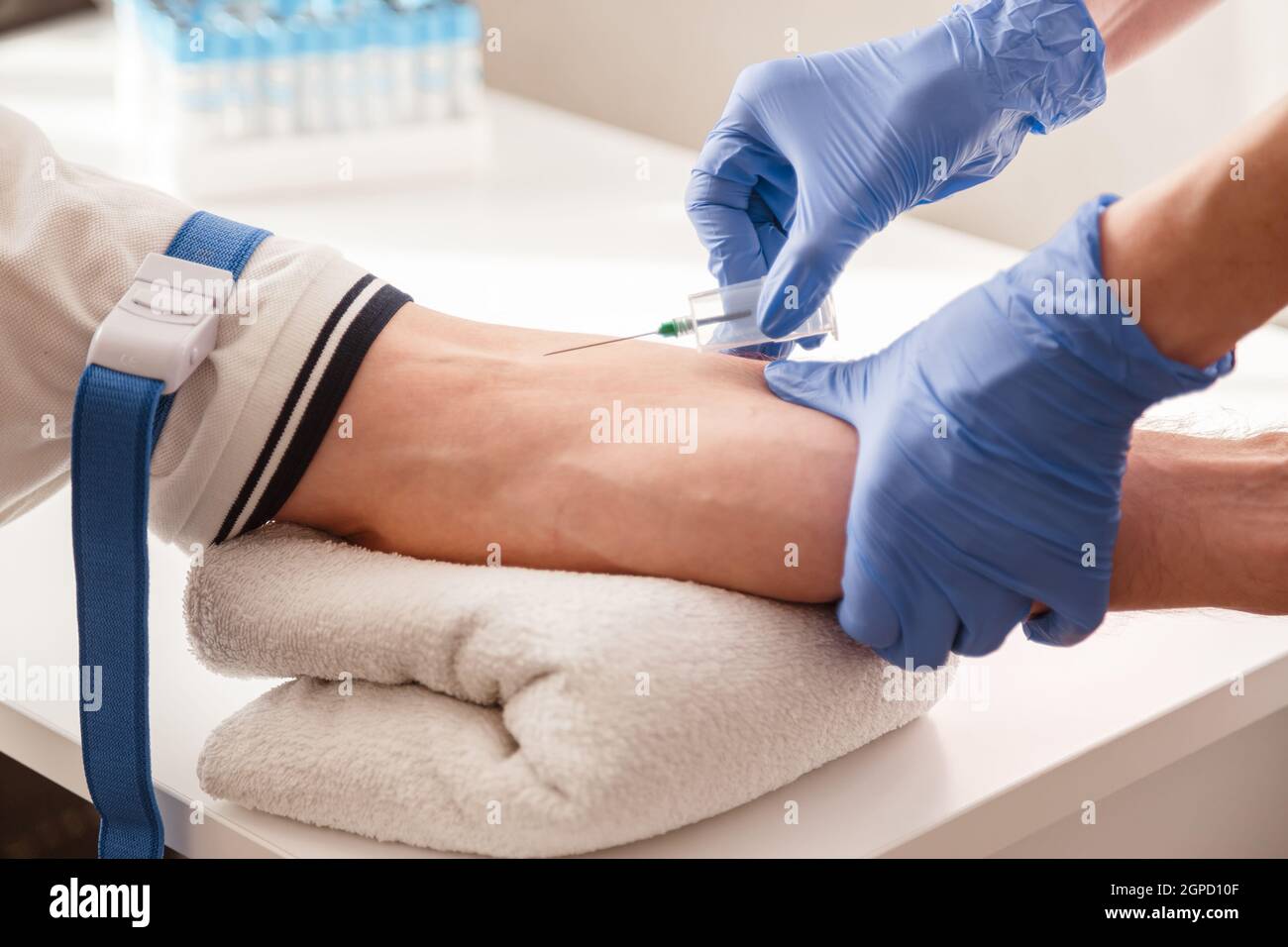 The nurse draws blood from a vein for test. Blood chemistry Stock Photo ...