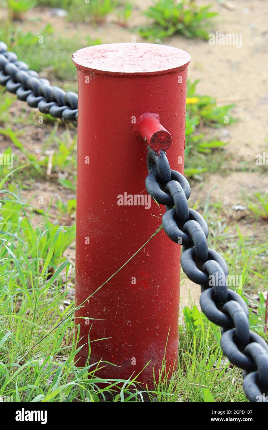 A vertical photo of a red chain link fence Stock Photo - Alamy