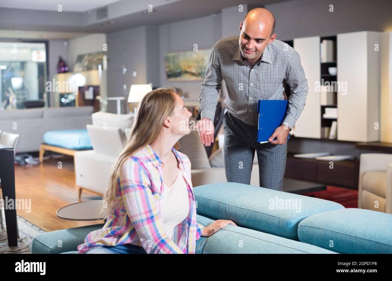 Woman is testing new furniture Stock Photo - Alamy