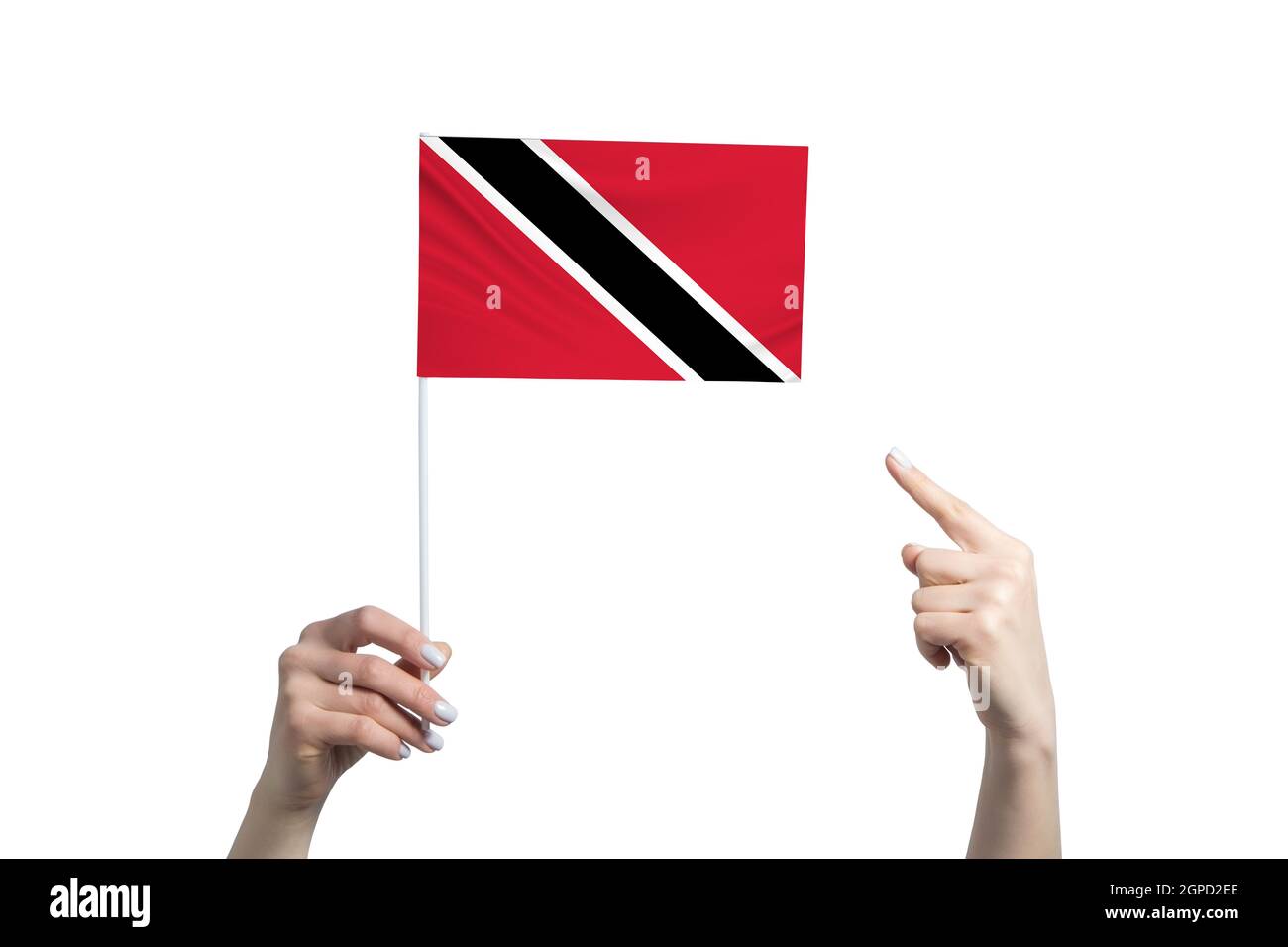 A beautiful female hand holds a Trinidad and Tobago flag to which she ...