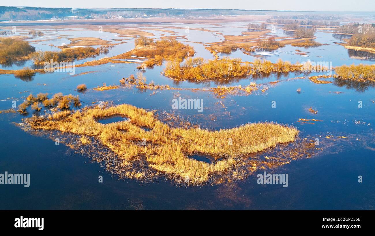 Spring melting river flood aerial panorama. Overflow water at ...