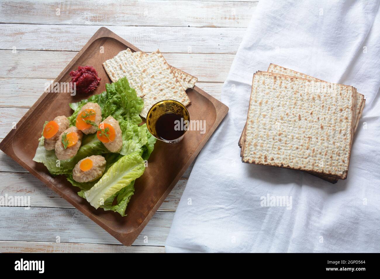 Passover traditional Jewish food- gefilte fish with carrots, lettuce ...