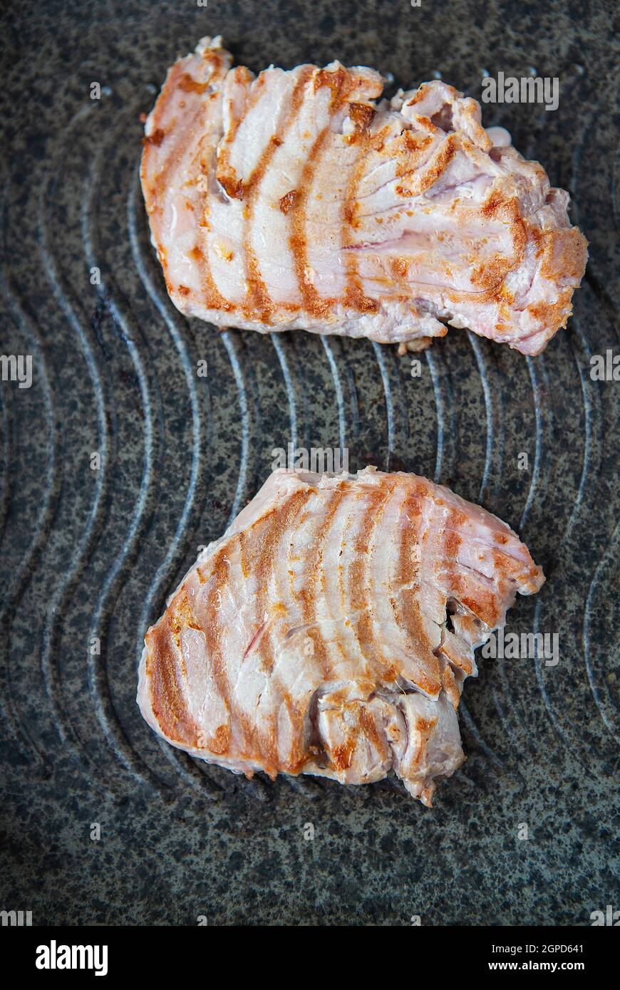 Grilled fresh tuna steak in a pan, top view. Delicious and healthy food ...