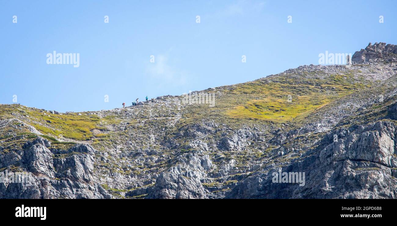 Picture of rugged mountains in the alps, blue sky with clouds Stock ...