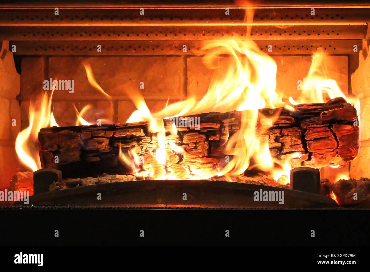 Closeup of a log burning in a fireplace Stock Photo - Alamy