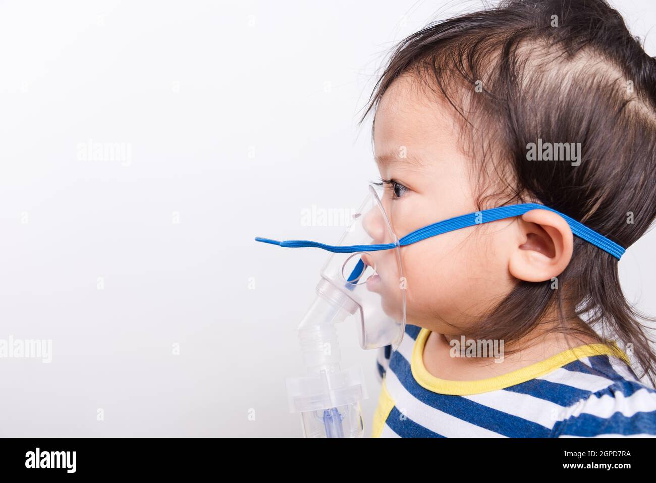 Closeup Asian face, Little baby girl sick her using steam inhaler ...