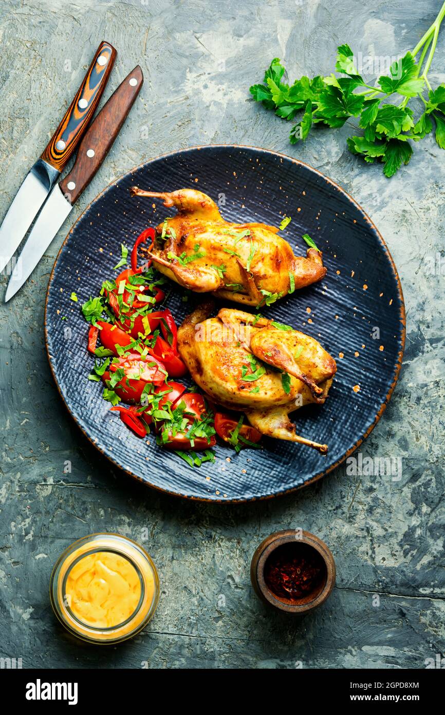 Roasted whole quail and spring vegetable salad.Tasty grilled quails ...