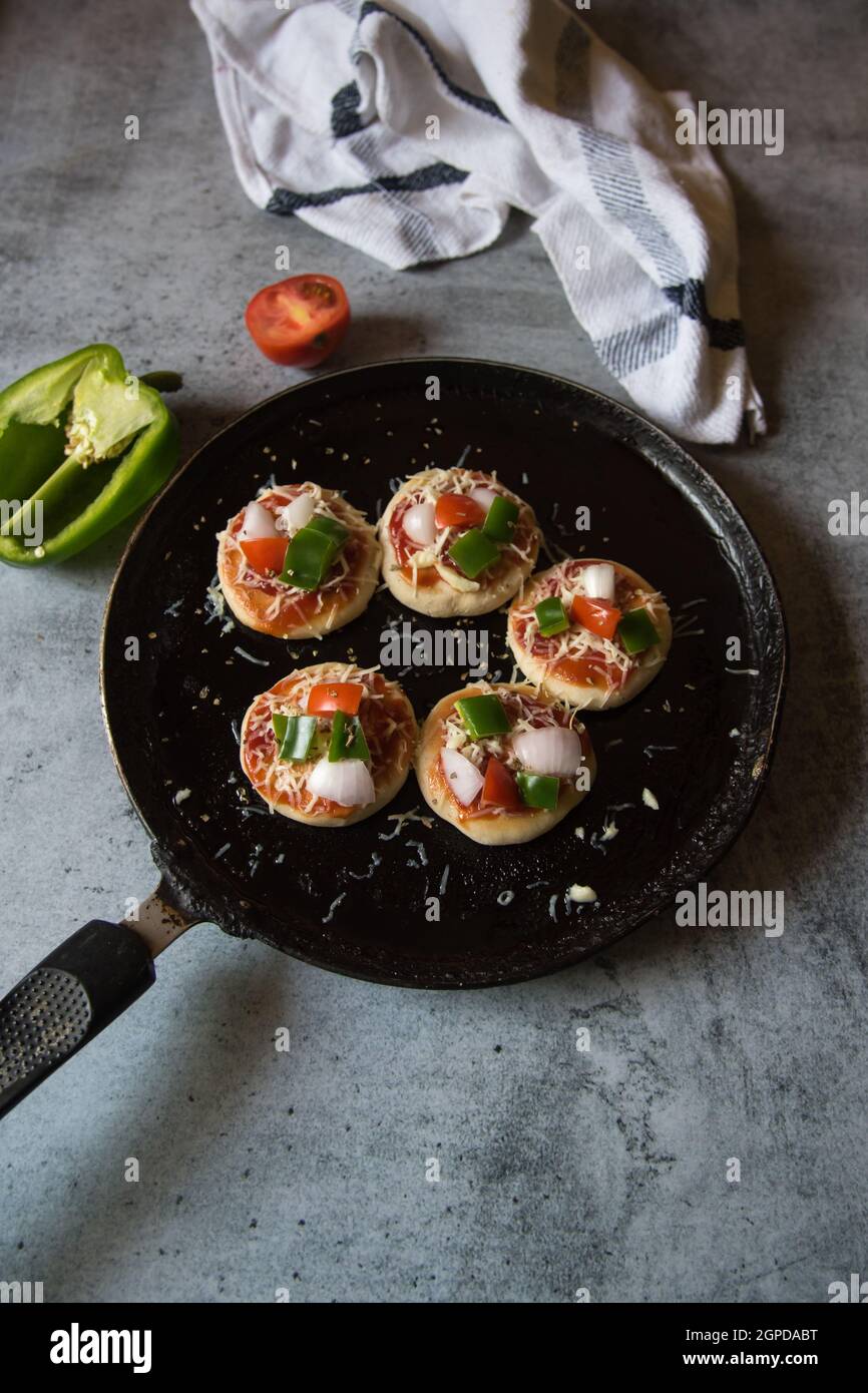 Popular Italian delicacy pizza. Ready to serve pizzas along with ...