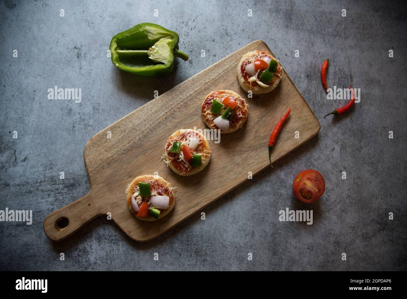 Popular Italian delicacy pizza. Ready to serve pizzas along with ...