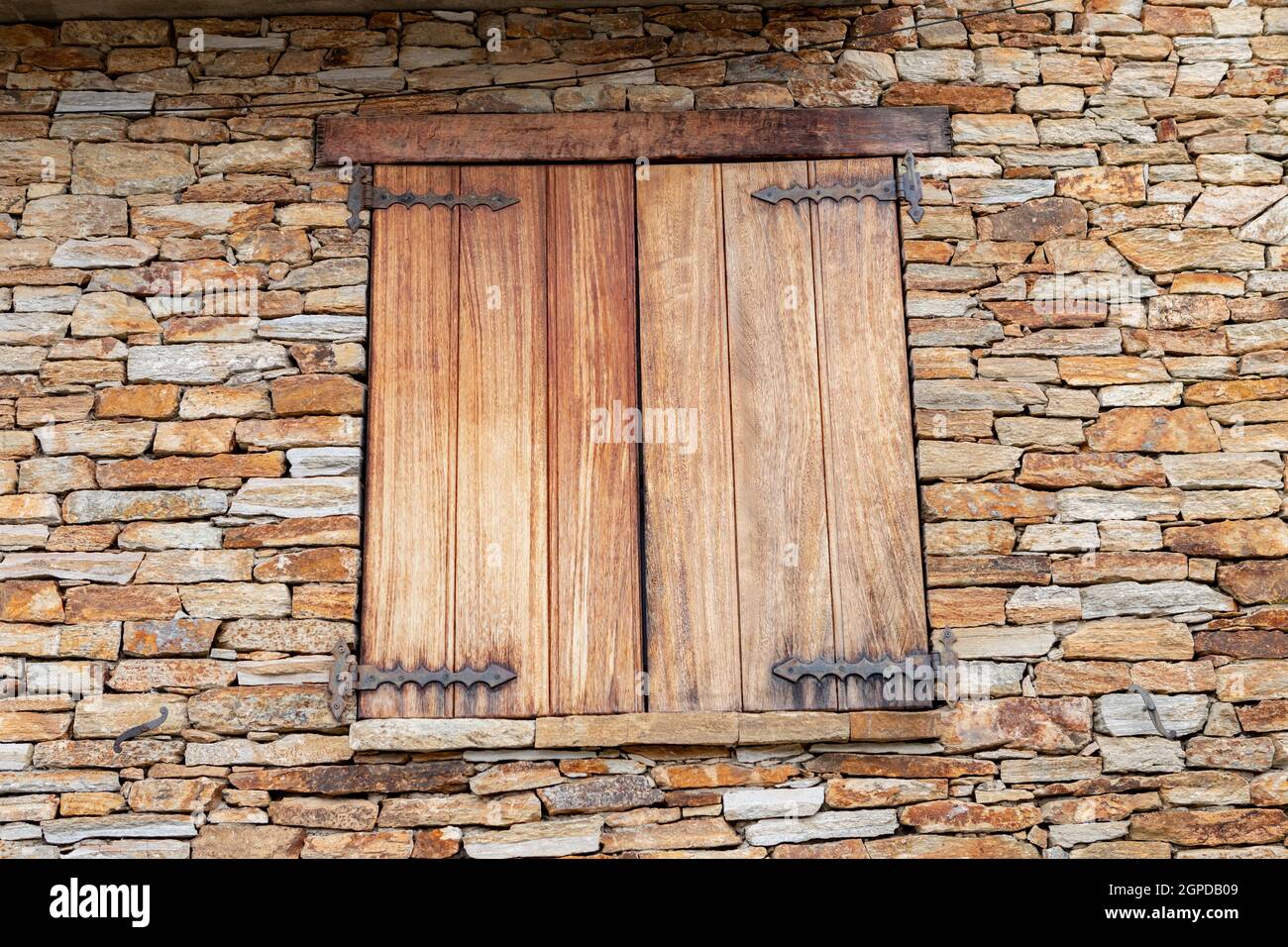 Closed wooden window on a nice stone wall Stock Photo - Alamy