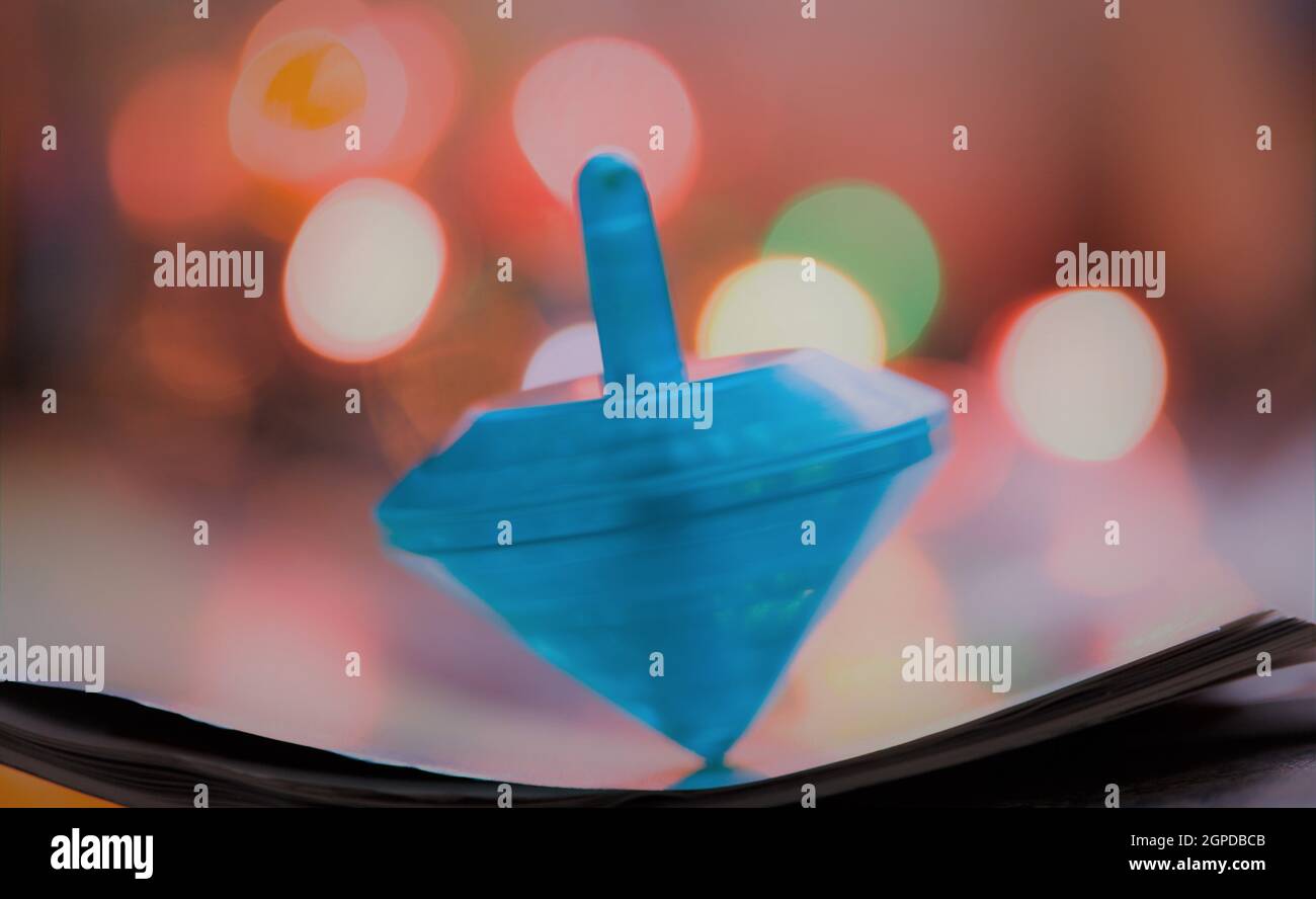 Energy of Motion - Close-up of a blue spinning top in motion Stock ...