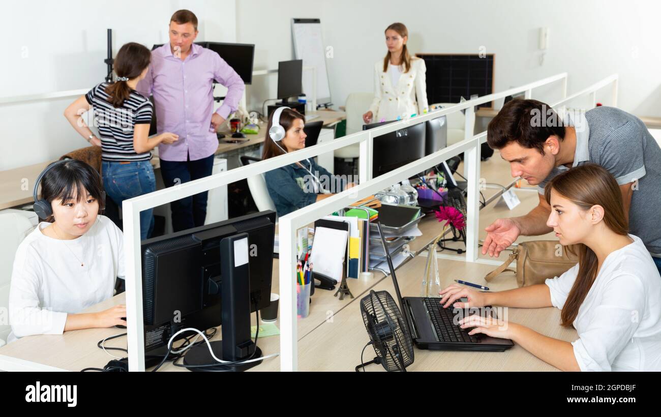 People working with computers and laptops in modern office Stock Photo ...