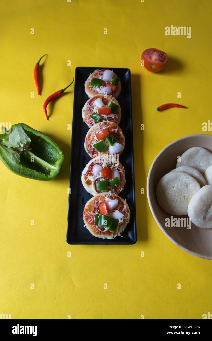 Popular Italian delicacy pizza. Ready to serve pizzas along with ...