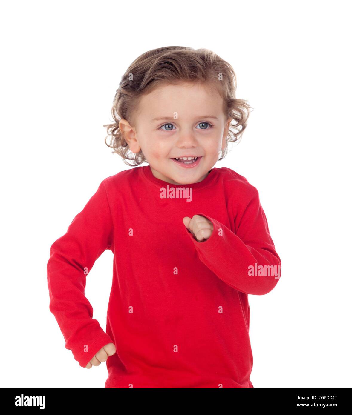 Beautiful little child two years old wearing red jersey moving his arms ...