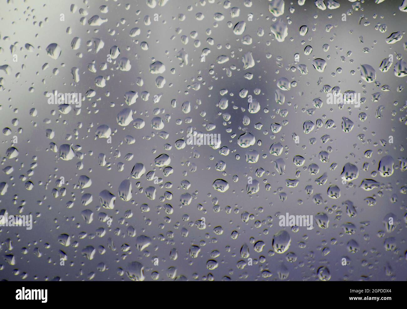 Glass with drops of rain water close up Stock Photo - Alamy