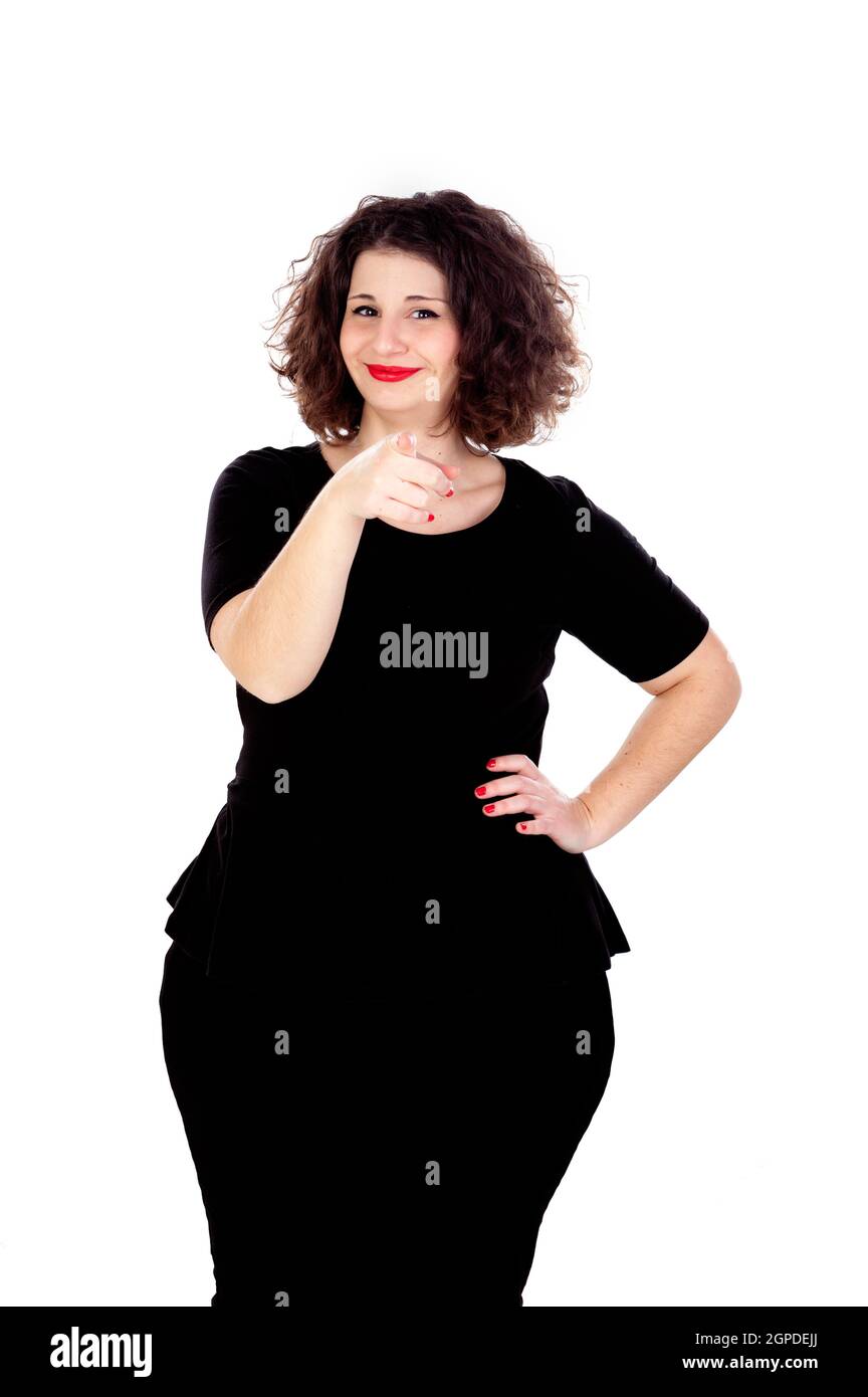 Beautiful curvy girl with black dress indicating something with the ...