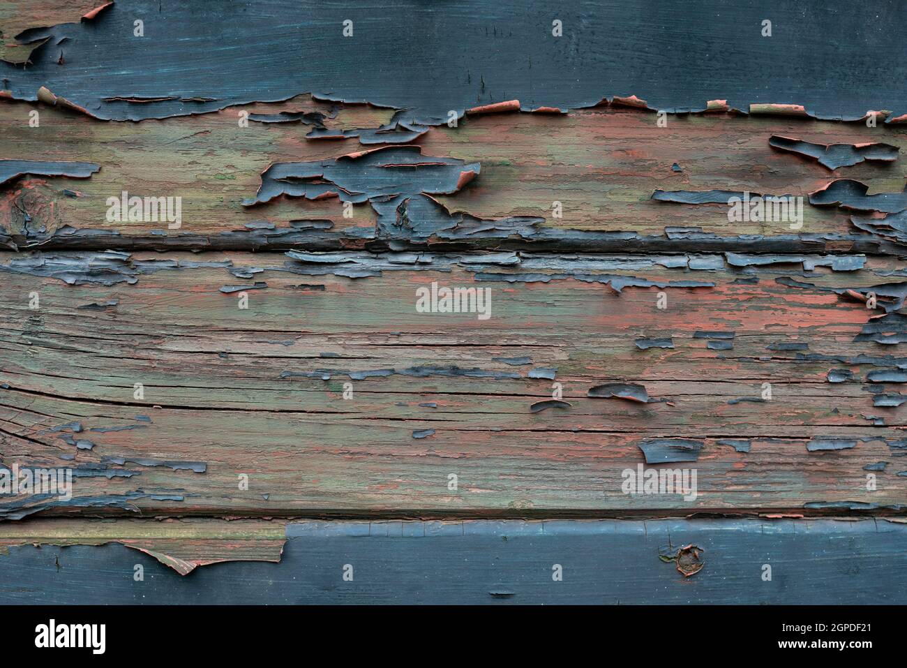Closeup of damaged paint on a wooden railroad car. Open air limestone ...